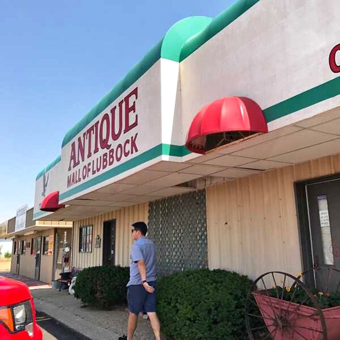 Red awnings and green trim? It's not Christmas, folks – it's the gateway to nostalgia! This facade screams "Come in, we've got stories to tell!" louder than a carnival barker.
