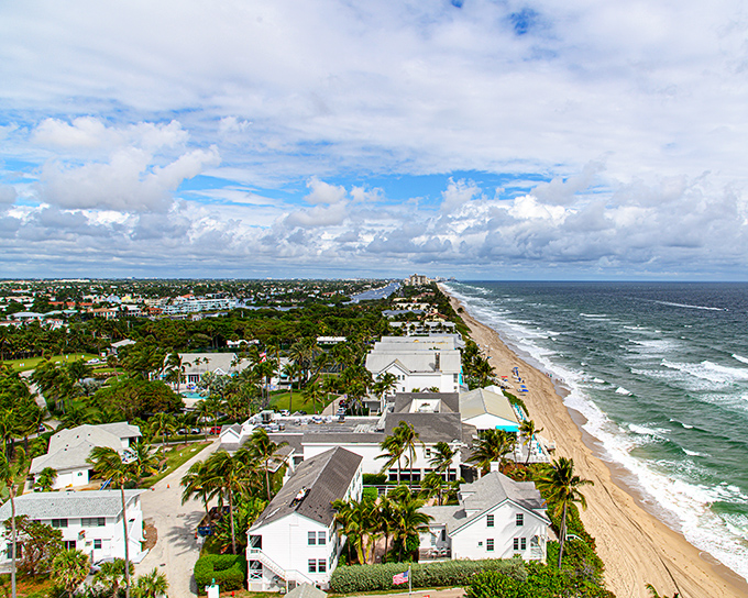 From up here, it's like someone spilled a box of Legos on a perfect beach. Colorful homes, sparkling water, and that lighthouse – Florida's own exclamation point!