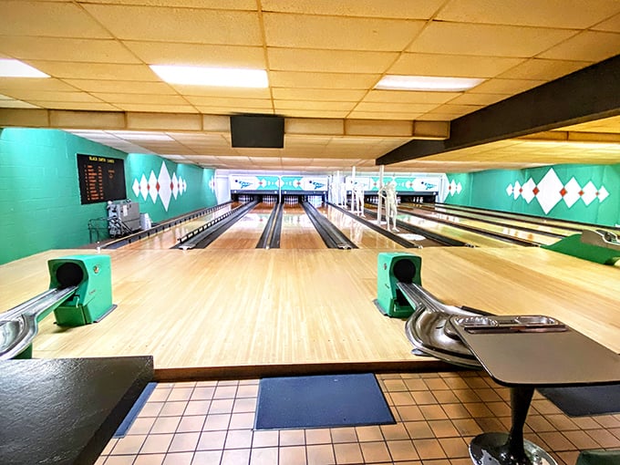 Lanes of dreams! The turquoise walls and gleaming wood create a bowling paradise that's part 1960s time capsule, part modern-day fun factory.
