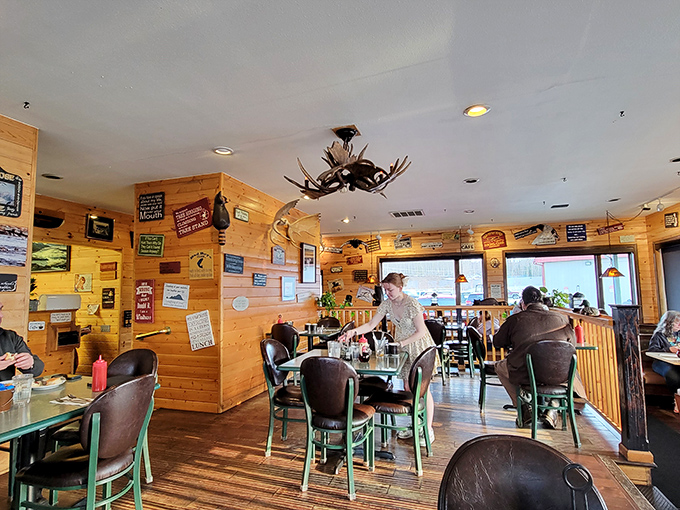 Step inside and you'll feel like you've wandered into a cozy Alaskan cabin. Is that a moose antler chandelier? Talk about local flavor!