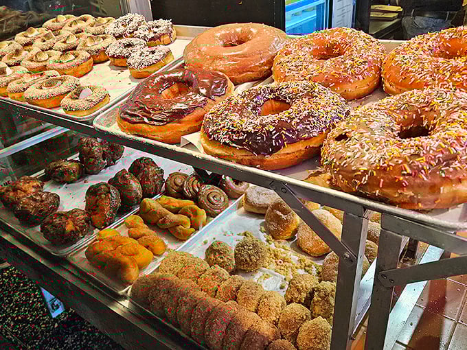 Behold the rainbow of fried perfection! From classic glazed to wild creations, Bob's display case is a choose-your-own-adventure in donut form.