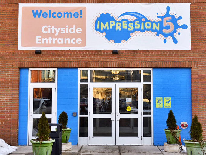 Open sesame to wonder! The Cityside Entrance beckons with a splash of blue, inviting curious minds of all ages to step into a world of discovery.