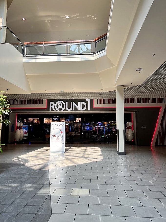 "Step into the looking glass, Alice! Round1's entrance is your portal to a wonderland of games, strikes, and neon-lit adventures."