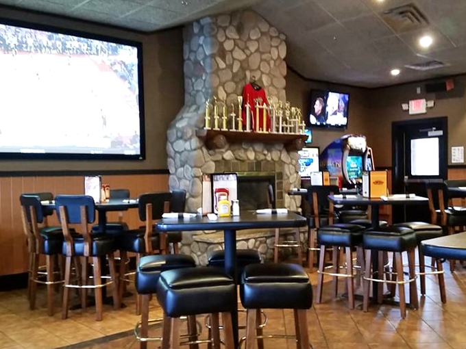 Step inside and feel the warmth! This cozy interior, complete with stone fireplace, is like a bear hug for your soul (and stomach).