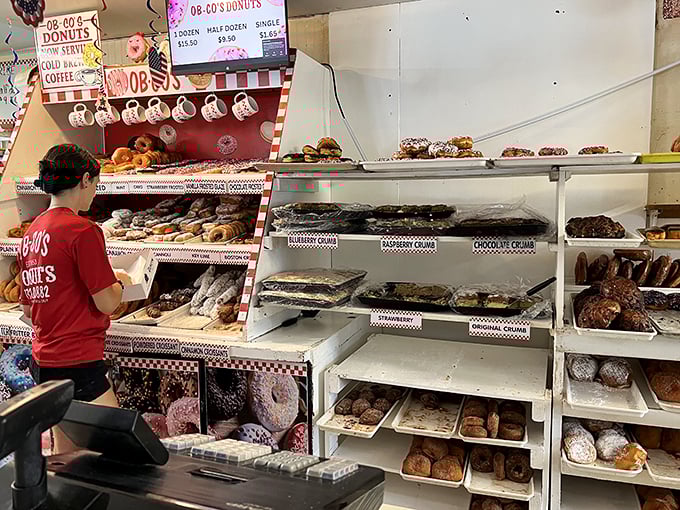 Donut nirvana awaits! This display case is like a treasure chest of circular gold, each shelf a new adventure in sugary bliss.