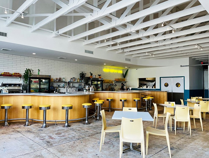 Step inside and feel the rhythm! The airy interior with its exposed beams and sleek bar is where Cuban cuisine meets modern chic.