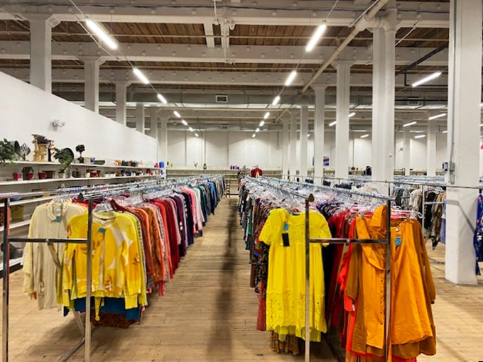 Behold the Narnia of secondhand fashion! Racks upon racks of colorful clothing stretch as far as the eye can see, promising sartorial adventures galore.