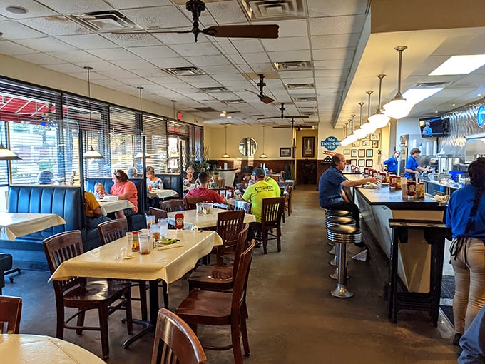 Step into a time machine of taste! This cozy interior feels like a warm hug from your favorite aunt, complete with comfort food and friendly faces.