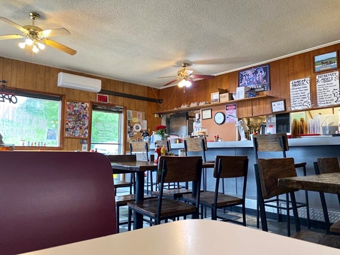 Step into a time machine, set to "cozy diner." Wood paneling, ceiling fans, and the promise of comfort food create an atmosphere as warm as grandma's kitchen.