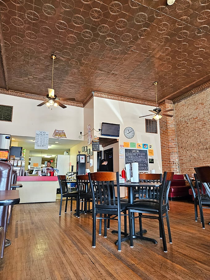 Step into a time capsule of deliciousness! The tin ceiling and exposed brick walls whisper tales of countless satisfied diners.