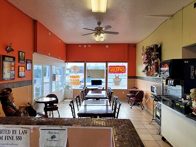 Step into a kaleidoscope of comfort! The interior's warm hues and cozy seating invite you to linger over your coffee and crullers.