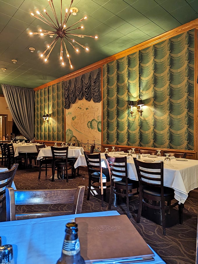 Step into a sea of green! This dining room's wavy curtains and starburst chandelier transport you to a swanky '60s supper club. Mad Men, meet Midwest magic.