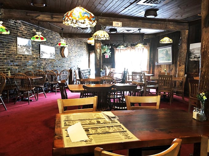 Tiffany lamps and exposed brick: a match made in tavern heaven. This cozy interior feels like your cool grandpa's living room, if he had impeccable taste in lighting.