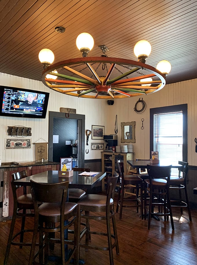 Saddle up for a feast! This wagon wheel chandelier sets the tone for a dining experience that's equal parts rustic charm and culinary adventure.