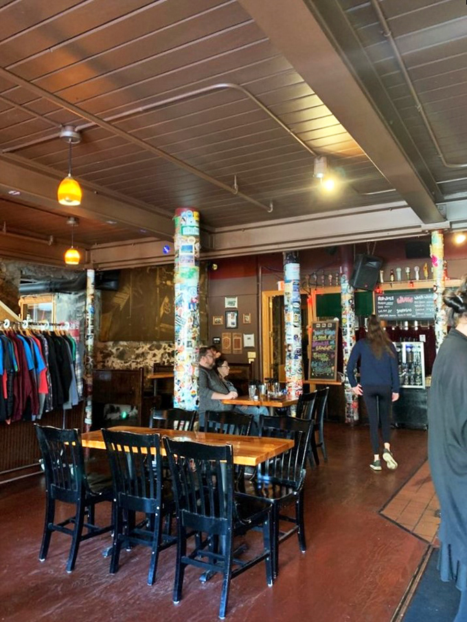 Step inside and let the sticker-covered pillars guide you. It's like a scrapbook of good times came to life!