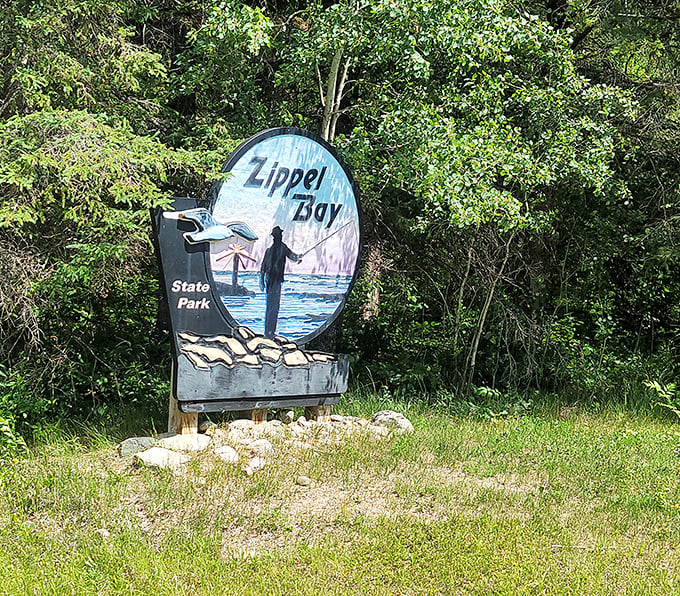 Welcome to Zippel Bay, where even the sign has better posture than most of us! This artistic entrance sets the stage for an adventure that's anything but cookie-cutter.