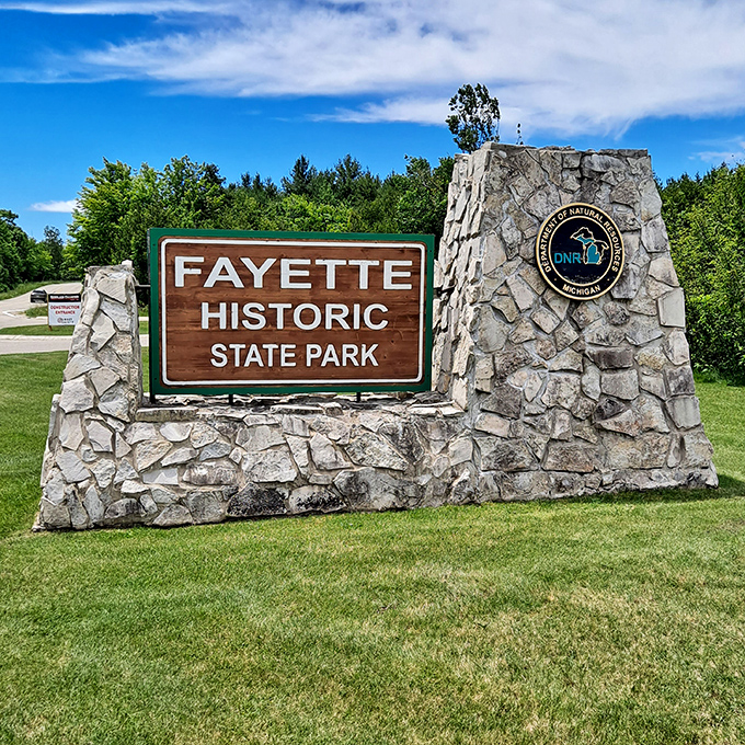 Welcome to history's front porch! This rock-solid entrance sign promises a journey through time that's as sturdy as the pioneers who built this place.