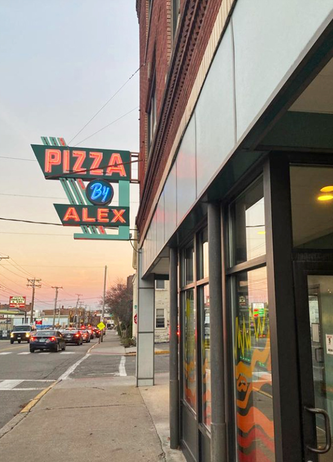 Pizza By Alex: Where neon dreams and cheesy realities collide! This retro sign promises a slice of nostalgia with every bite.