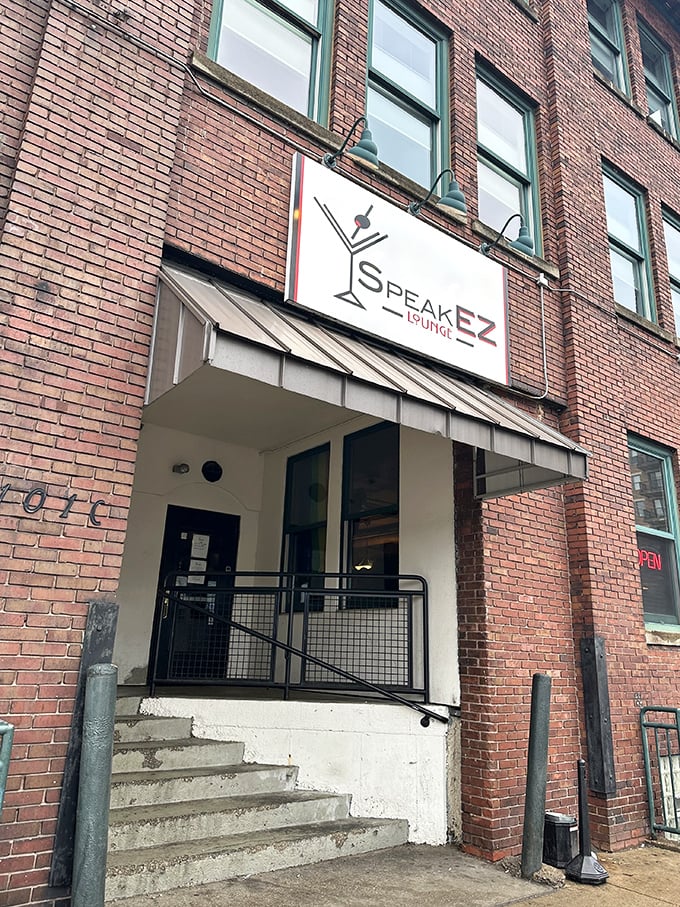 SpeakEZ does it! This brick facade conceals a jazz-filled haven where the password is "thirsty" and the drinks are the bee's knees.