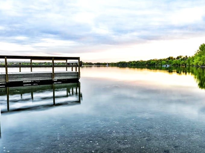 Sunset serenity at Bde Maka Ska. It's like nature's own mood lighting, perfect for romantic strolls or contemplative hot dog eating.