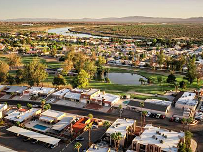 Who needs a bird's eye view when you can have a drone's eye view? Bullhead City unfolds like a patchwork quilt of houses, RVs, and that shimmering ribbon of liquid gold.