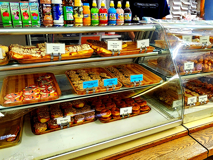 Behold, the glass case of temptation! A dazzling array of pastries that would make even Mary Berry weak in the knees.