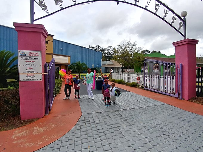 Through these gates lies a world of wonder! It's like stepping into a Technicolor dream where adulting is strictly prohibited.