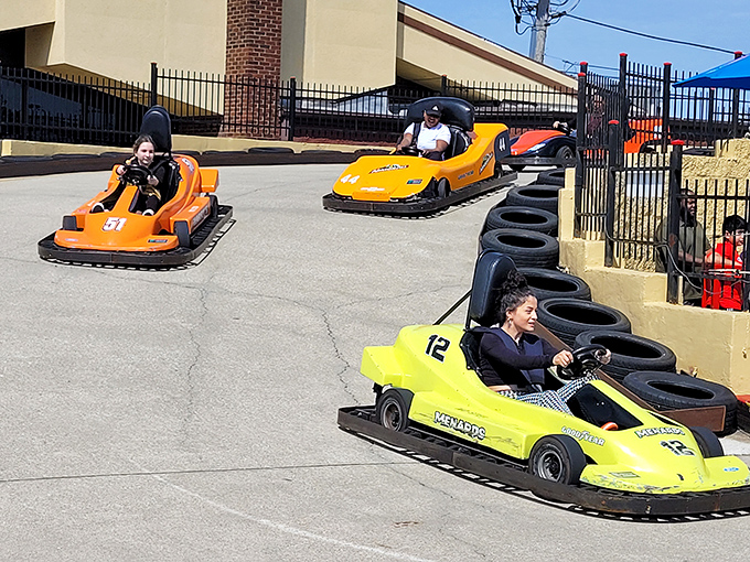 "Pedal to the metal, kiddos! These go-karts are faster than a vampire running from garlic bread. Ready, set, zoom!"