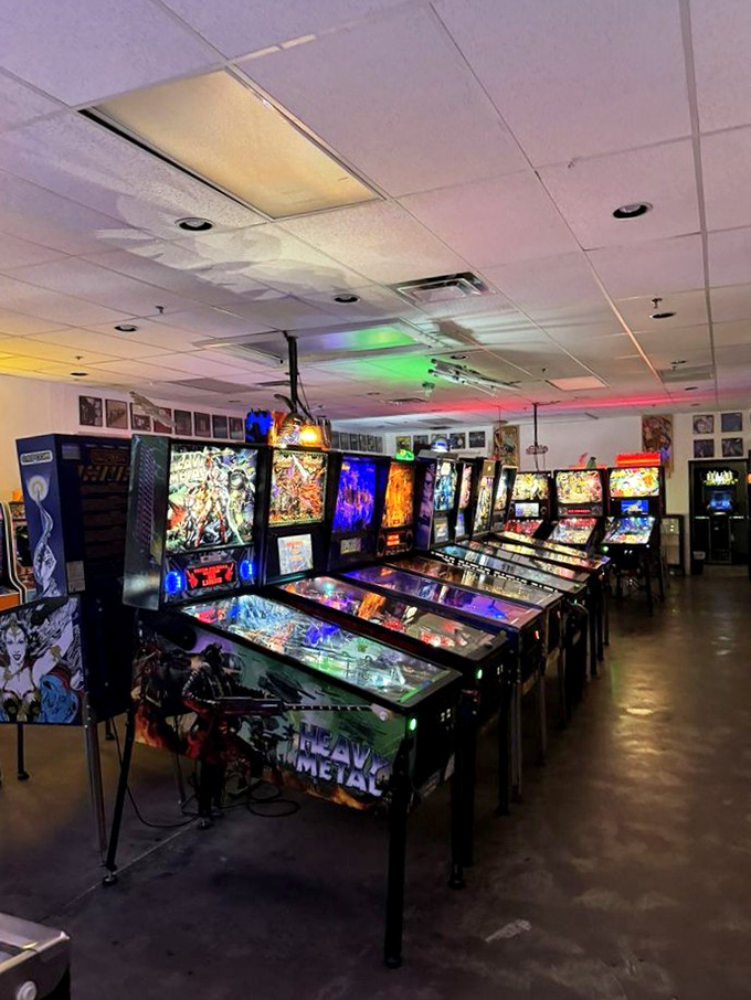 Behold the electric forest of arcade cabinets! It's like someone bottled the 80s, added LED, and sprinkled in a dash of modern magic.
