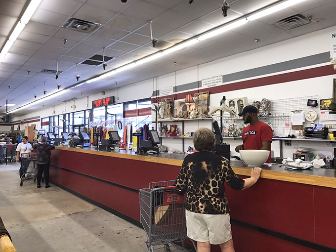 At the checkout, where dreams and budgets meet. These friendly faces are the gatekeepers of your newfound treasures, ready to send you off with a bargain and a smile.