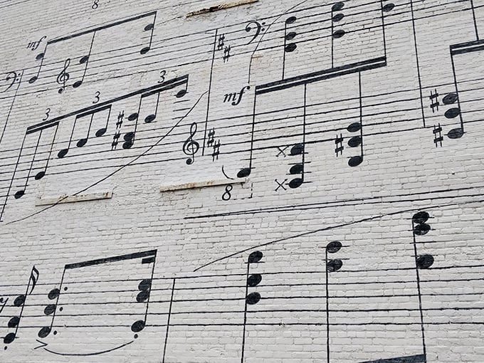 Talk about reading between the lines! This close-up reveals the intricate details that make the Music Wall a true masterpiece.
