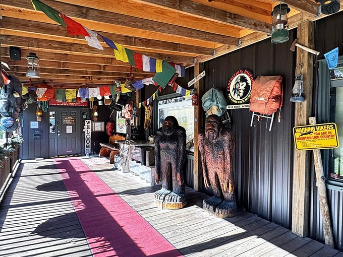 Welcome to Bigfoot's front porch! Colorful flags and wooden posts create an atmosphere that's part wilderness, part carnival. Sasquatch sure knows how to throw a welcome party!