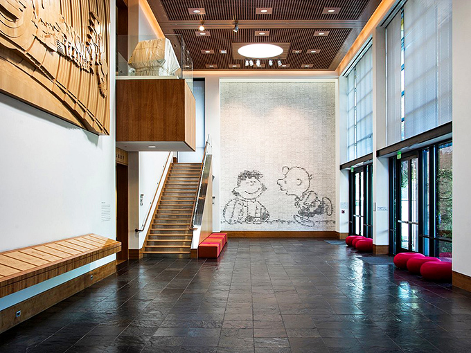 Step into a world where happiness is measured in pen strokes. This entryway sets the tone for a journey through the mind of a comic genius.