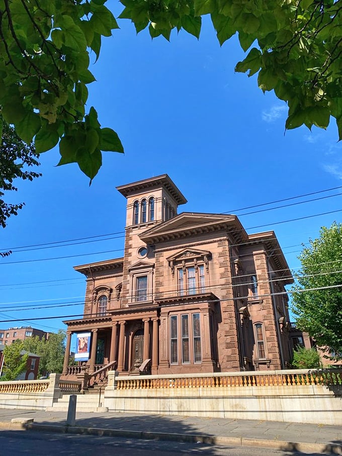 Framed by lush greenery, this architectural masterpiece stands prouder than a peacock at a feather convention.