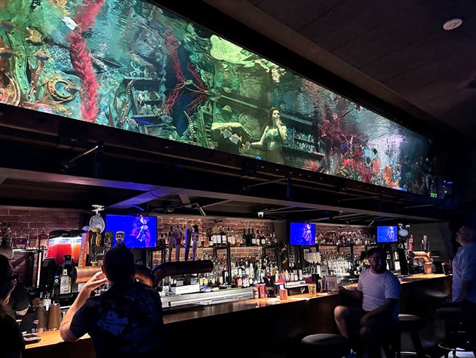 Forget portholes - this bar gives you a front-row seat to Poseidon's private aquarium. Just don't tap on the glass, you might startle the bartender!
