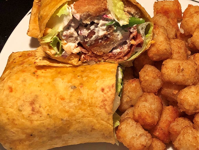 Behold, the wrap that launched a thousand food comas! This handheld masterpiece is proof that sometimes, the best things in life are rolled.
