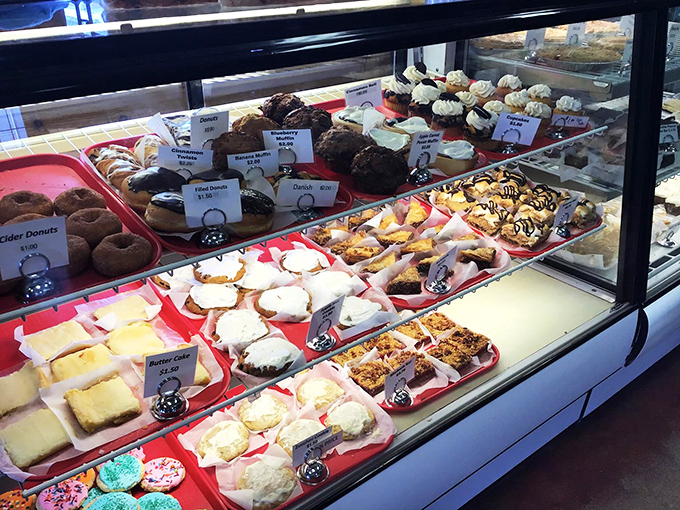 Behold the altar of sweetness! This display case is where diets come to die and happiness is served by the slice.