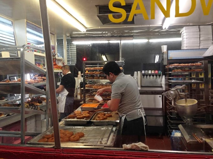 Behind the scenes of sugar-coated magic. These donut artisans are like Willy Wonka's elves, crafting edible joy in the wee hours.