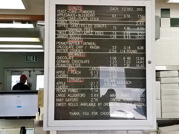 Behold, the sacred text of sweetness! This menu board is like a treasure map, guiding you to sugary riches. Who knew paradise had such reasonable prices?