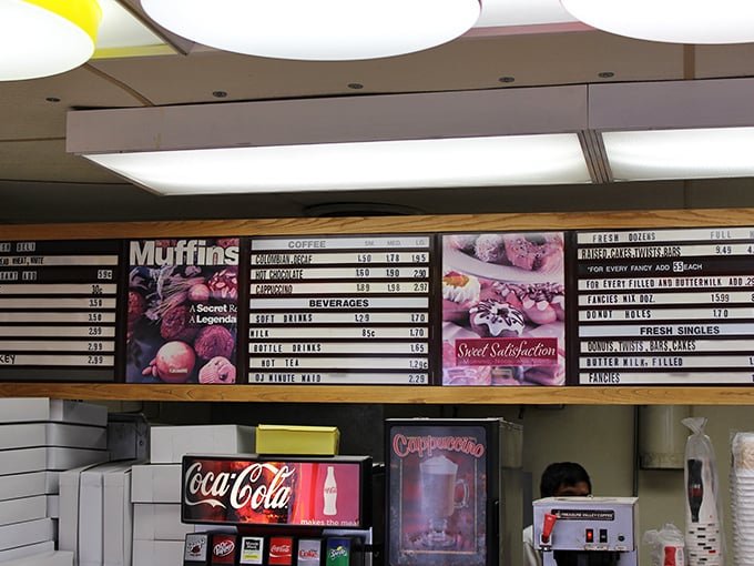 Decisions, decisions! This menu board is a roadmap to deliciousness, offering everything from classic glazed to gourmet creations.