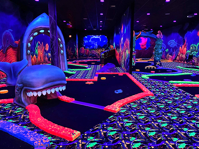 Neon sharks and glowing coral reefs? This mini-golf course is what happens when Finding Nemo meets Tron.