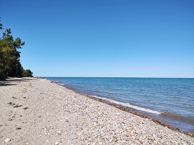 Lake Huron's shoreline: where pebbles meet infinity. This beach is nature's version of a zen garden, minus the tiny rake and plus endless possibilities for skipping stones.