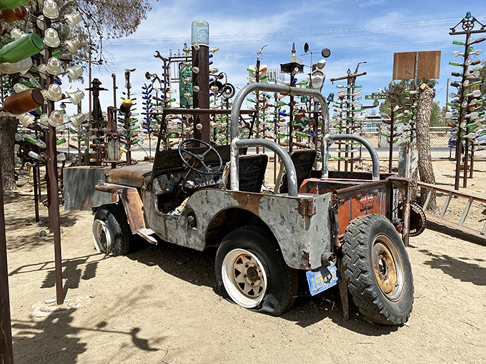 Bottled brilliance! This rusty ride takes center stage in a forest of glass and metal &ndash; talk about an intoxicating sight!