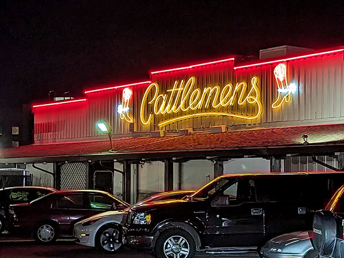 Neon dreams and beefy schemes! Cattlemen's sign shines like a beacon for hungry cowboys and city slickers alike.