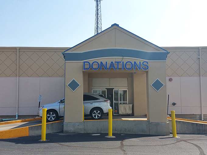 "Donations" sign beckons like a siren song. Goodwill Topeka: where one person's clutter becomes another's conversation piece.
