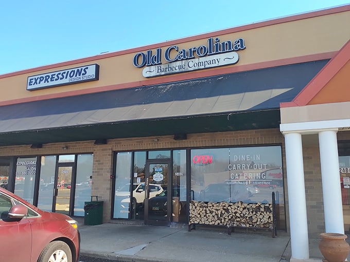 Old Carolina Barbecue Company: That firewood stack is like a siren song for smoke lovers. Resistance is futile!