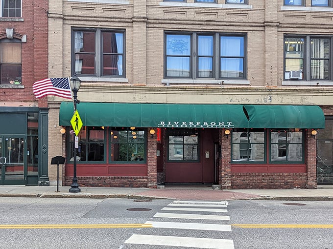 Riverfront Barbeque & Grille: Classic brick, green awning, and the promise of finger-licking goodness. It's like comfort food got a makeover!