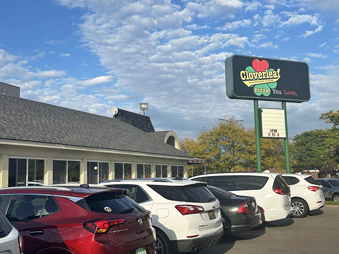 Cloverleaf's sign promises pizza you'll love, and boy, do they deliver! It's like a warm, cheesy hug for your taste buds.