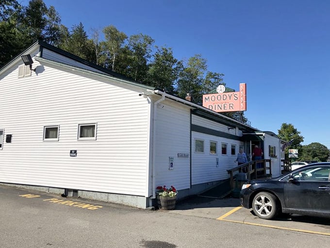 Where hungry travelers find pie paradise! Moody's classic sign beckons weary road-trippers to indulge in flaky, fruity bliss.
