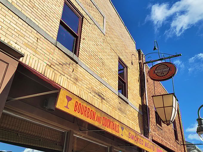 Part saloon, part smokehouse, all delicious. Union Woodshop's sign swings with the promise of meaty adventures ahead.